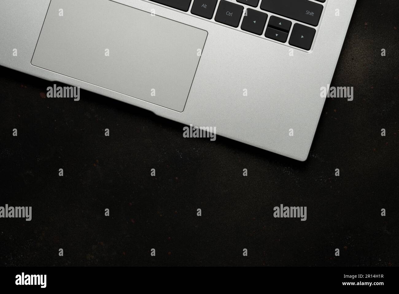 Top view of laptop on black background. Flat lay, top view office table ...