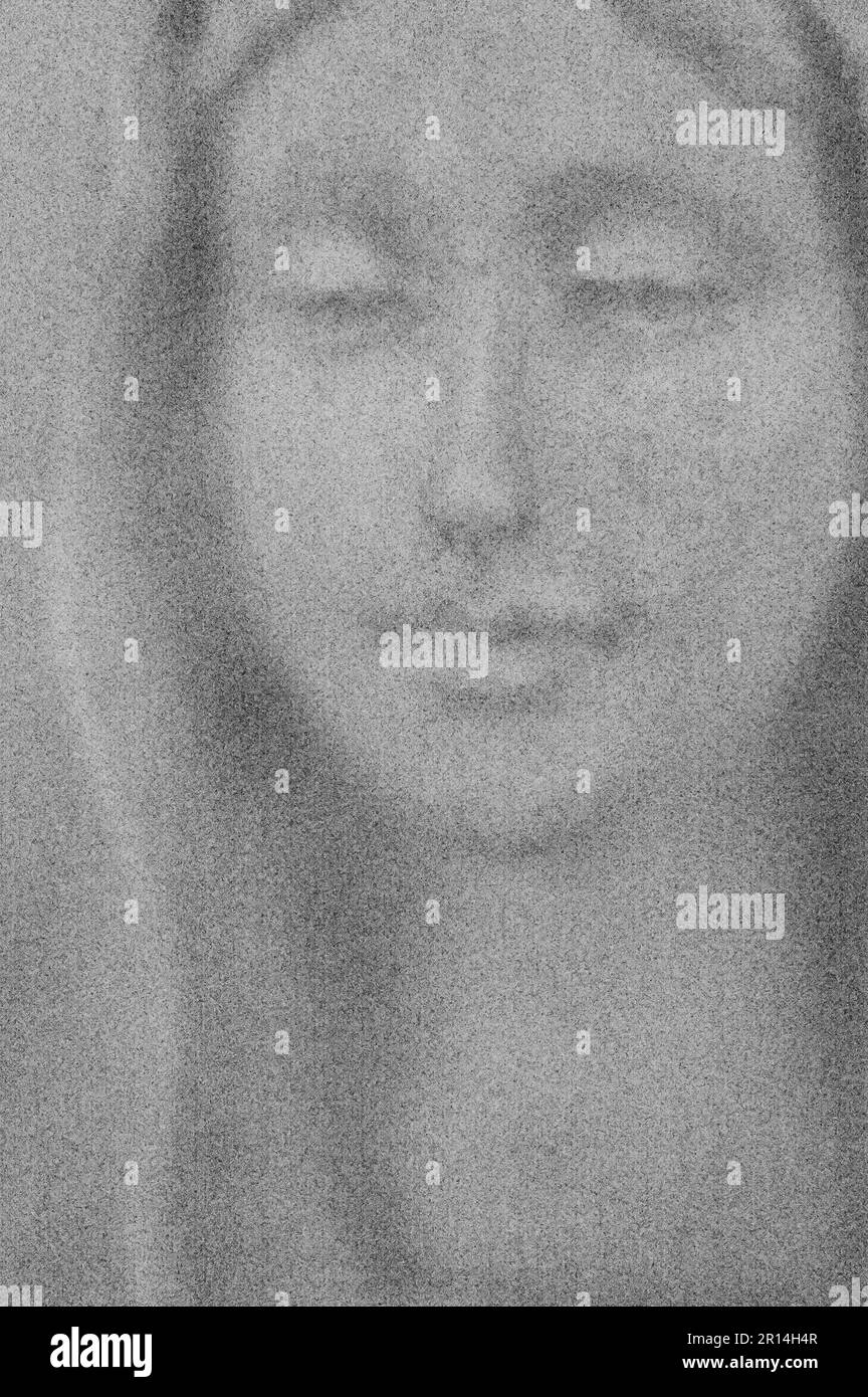 Cast model of serene woman with head covering and eyes lwoered in ...