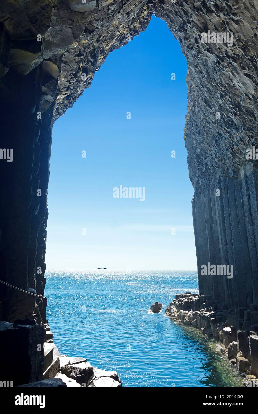 Iona island seen from the inside of the famous Fingal's Cave at Staffa ...