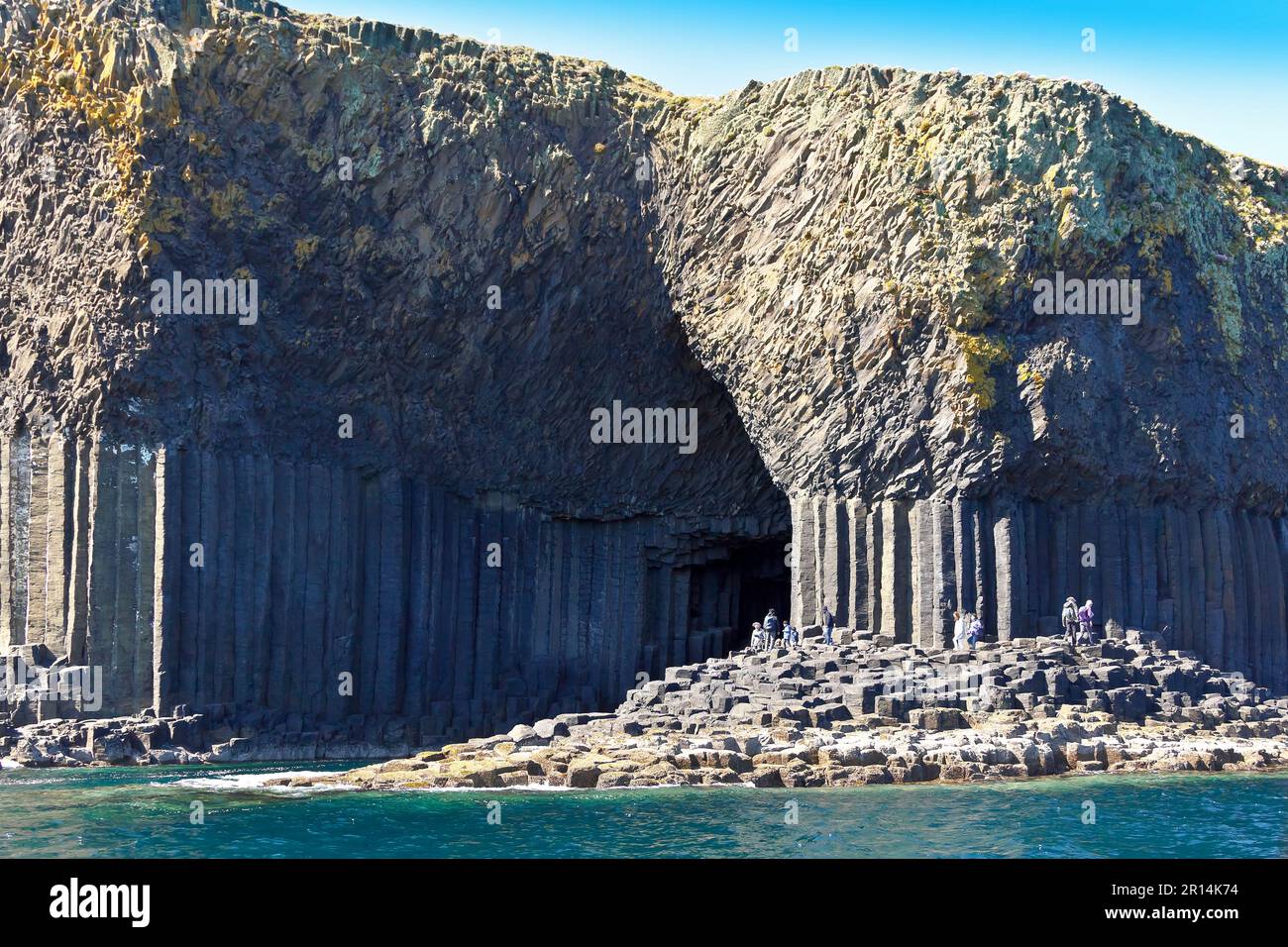 Staffa island, Inner Hebrides, Scotland - June 14, 2015: Tourists ...