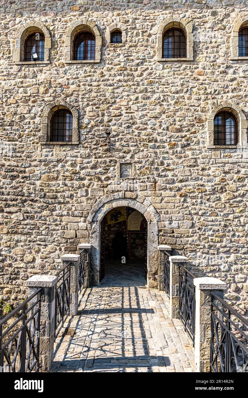 An old stone castle entrance with multiple windows. Kalabaka, Greece ...