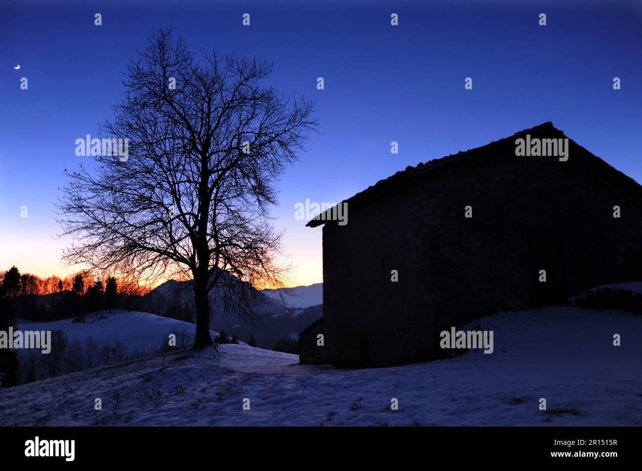 Mountain cottage at night with snow Stock Photo - Alamy