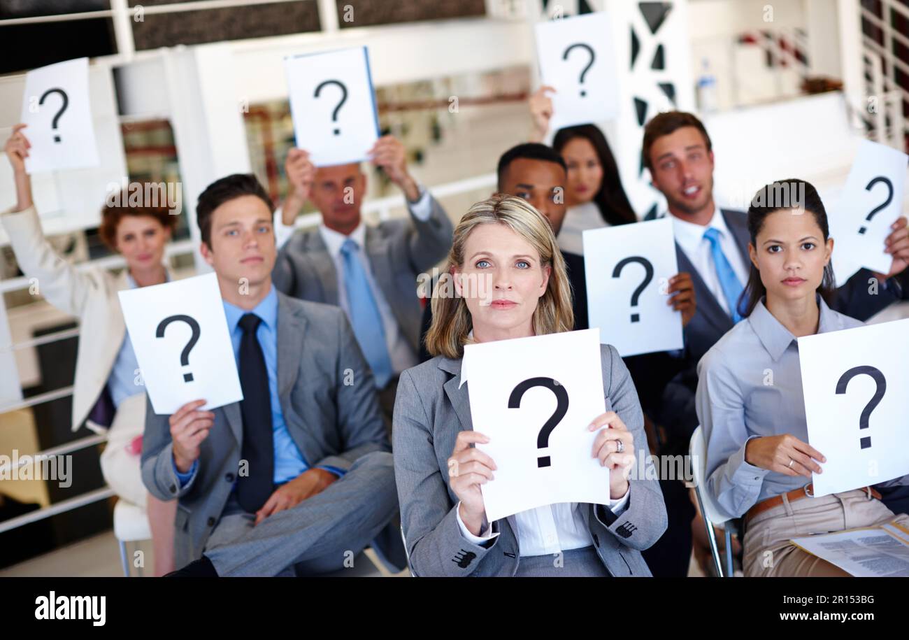 Business team holding question marks hi-res stock photography and ...
