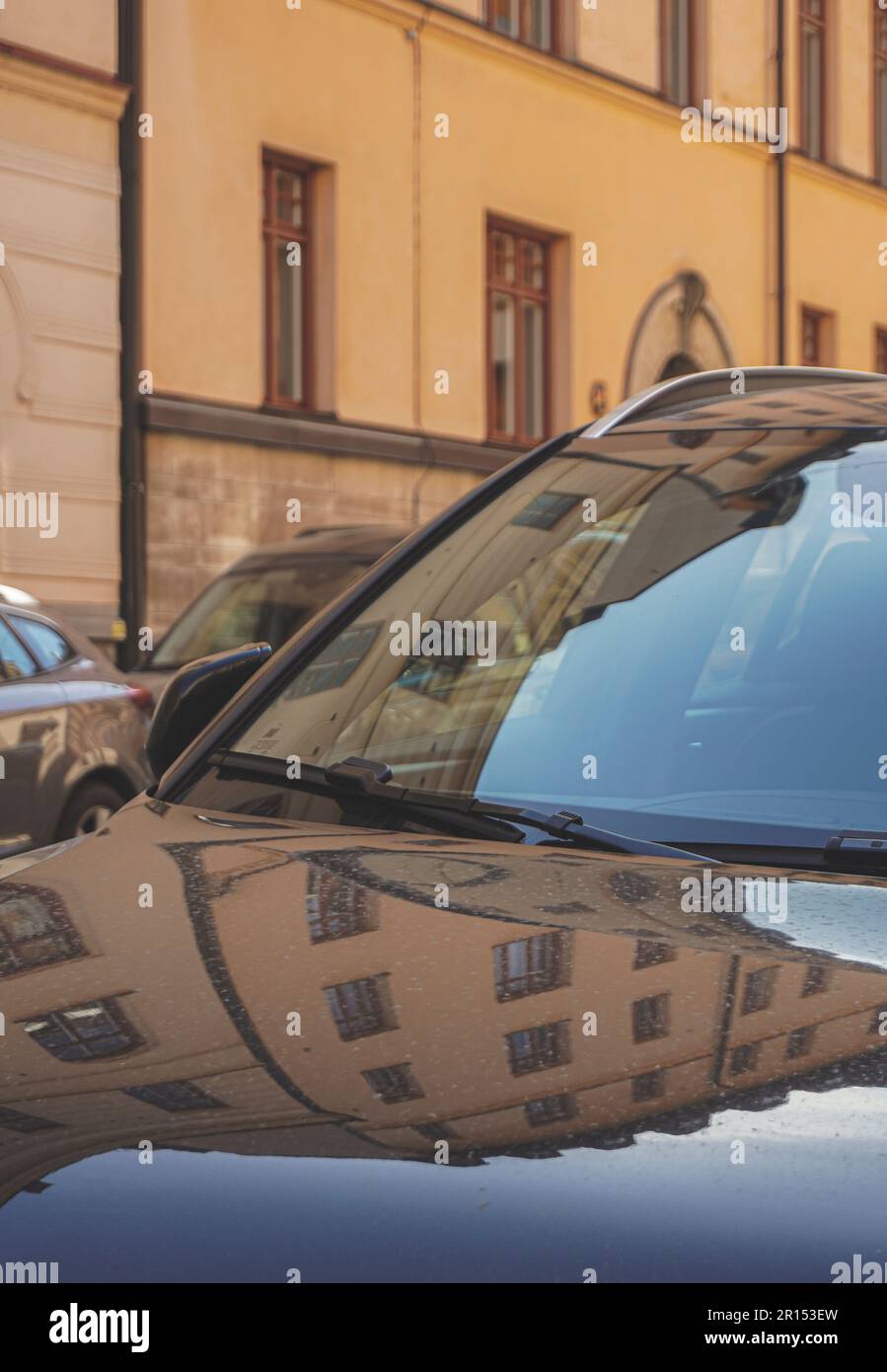 a car parked on the side of a building Stock Photo - Alamy