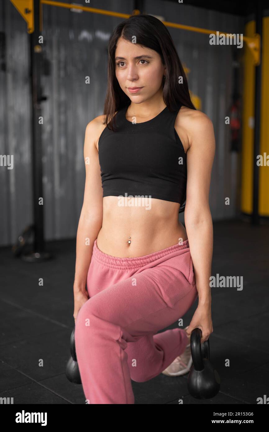 exercise routine, performing strength exercises with dumbbells in the ...