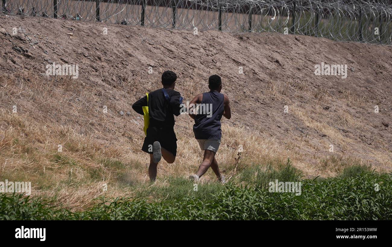 Ciudad Juarez, Mexico. 11th May, 2023. Two young migrants from ...