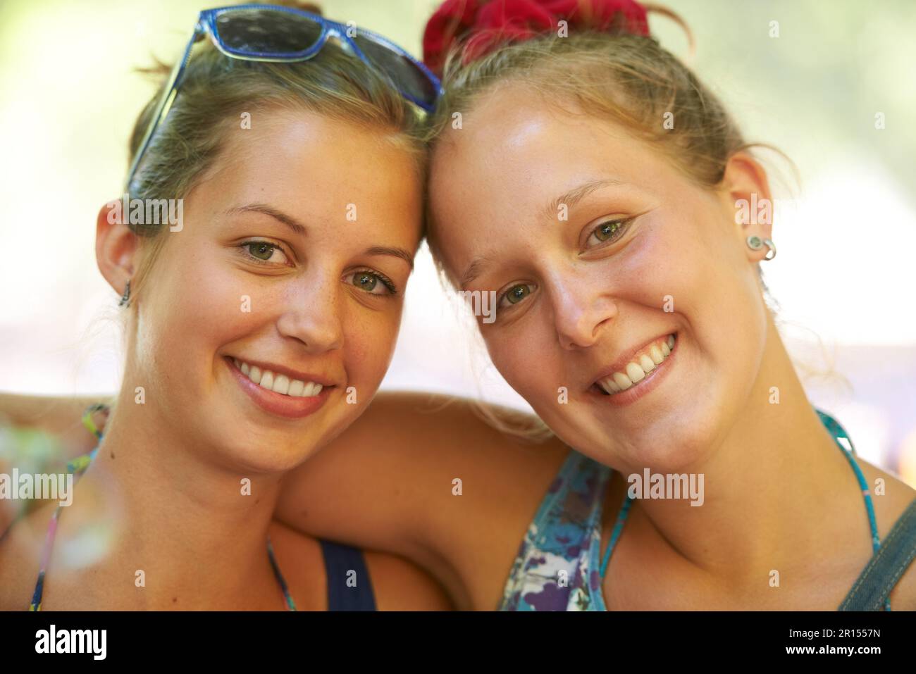 Sharing a special moment. Portrait of two happy female friends at an outdoor festival Stock ...