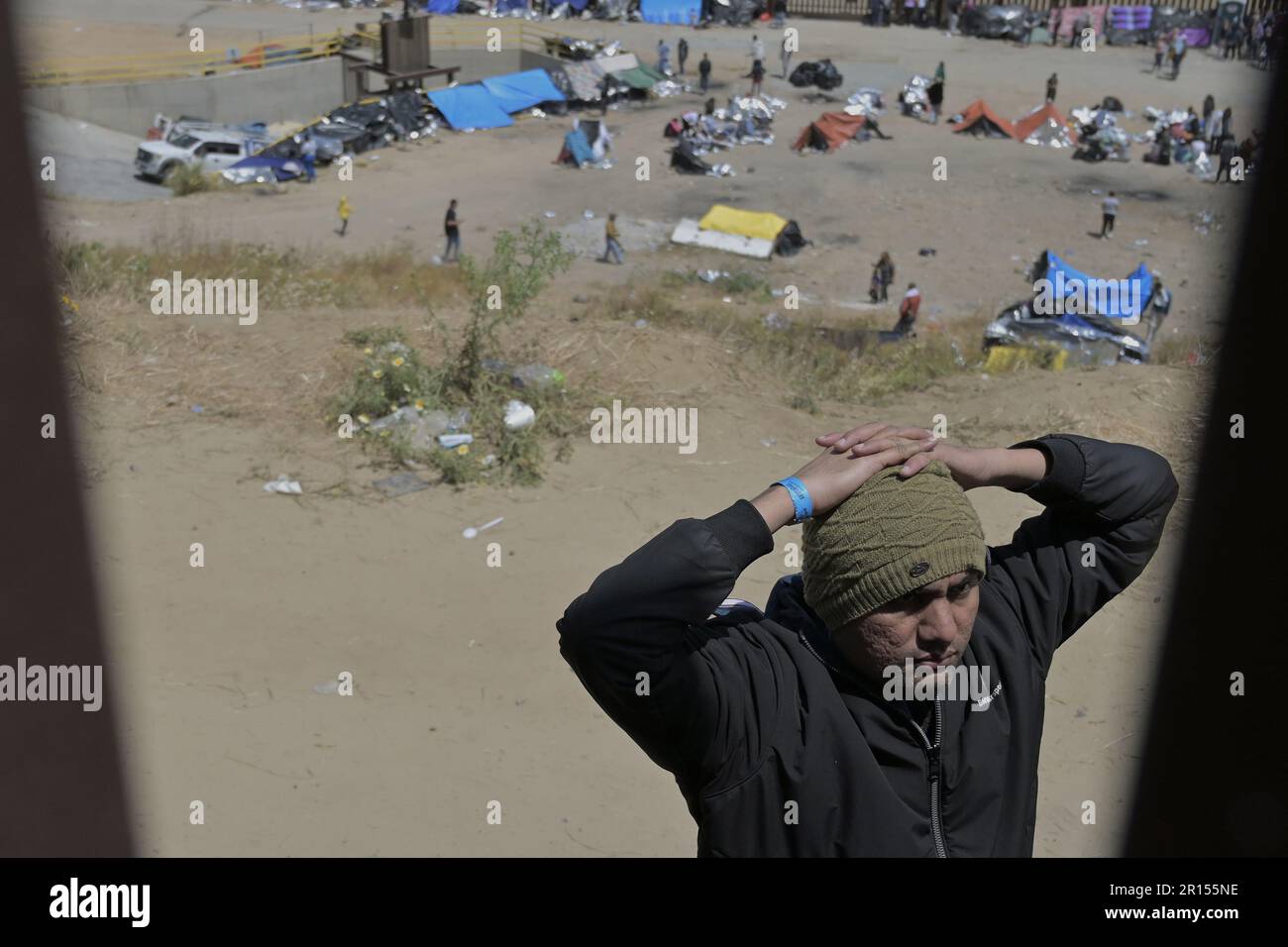 Tijuana, Mexico. 11th May, 2023. A migrant from India waits stuck ...