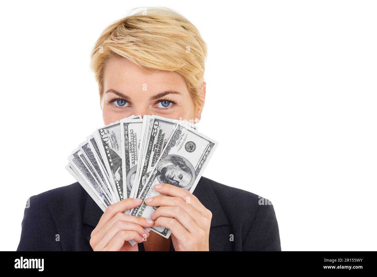 Hiding behind her wealth. Portrait of a young woman holding money in ...
