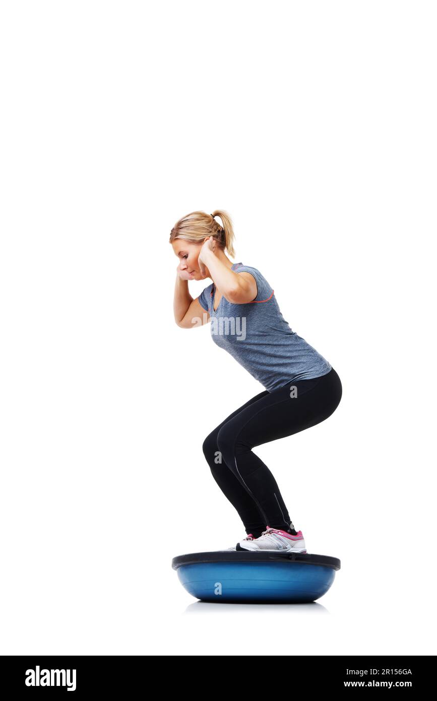 She follows a strict exercise plan. A beautiful young woman standing on ...