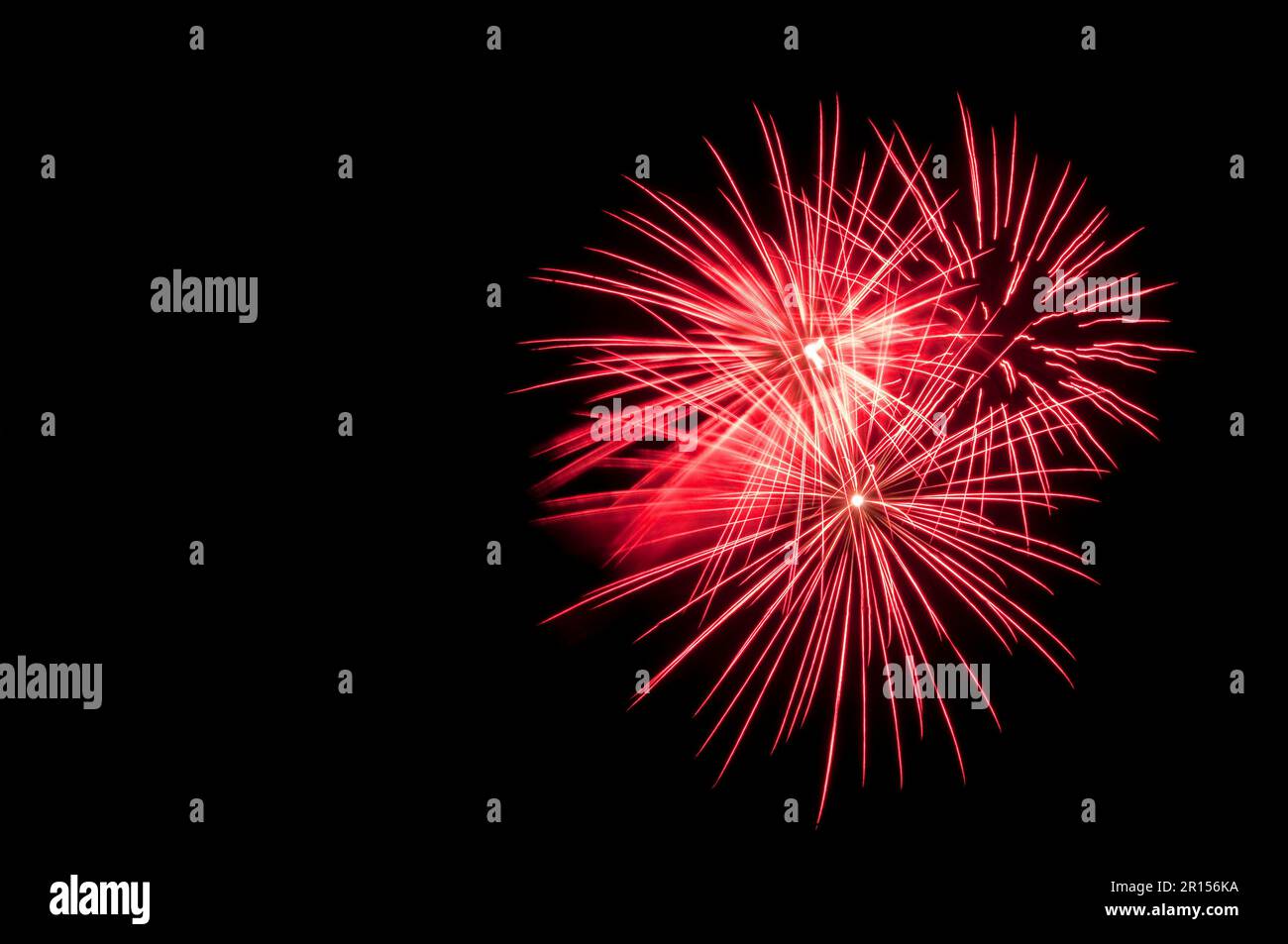 Red fireworks in the dark night. Black background Stock Photo - Alamy