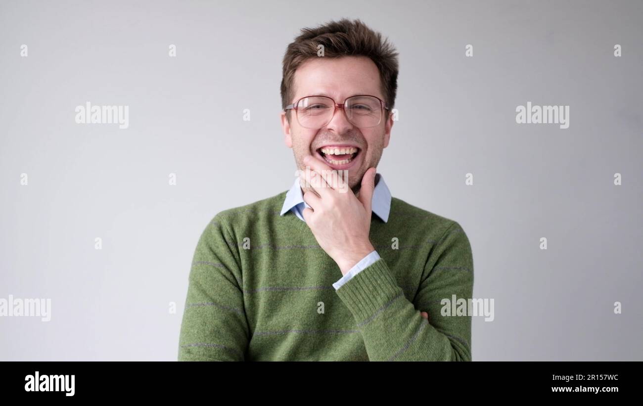 European funny young man is laughing loudly. Positive emotion Stock ...