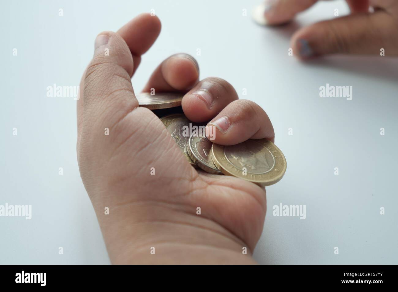Piggy bank many coins hi-res stock photography and images - Alamy