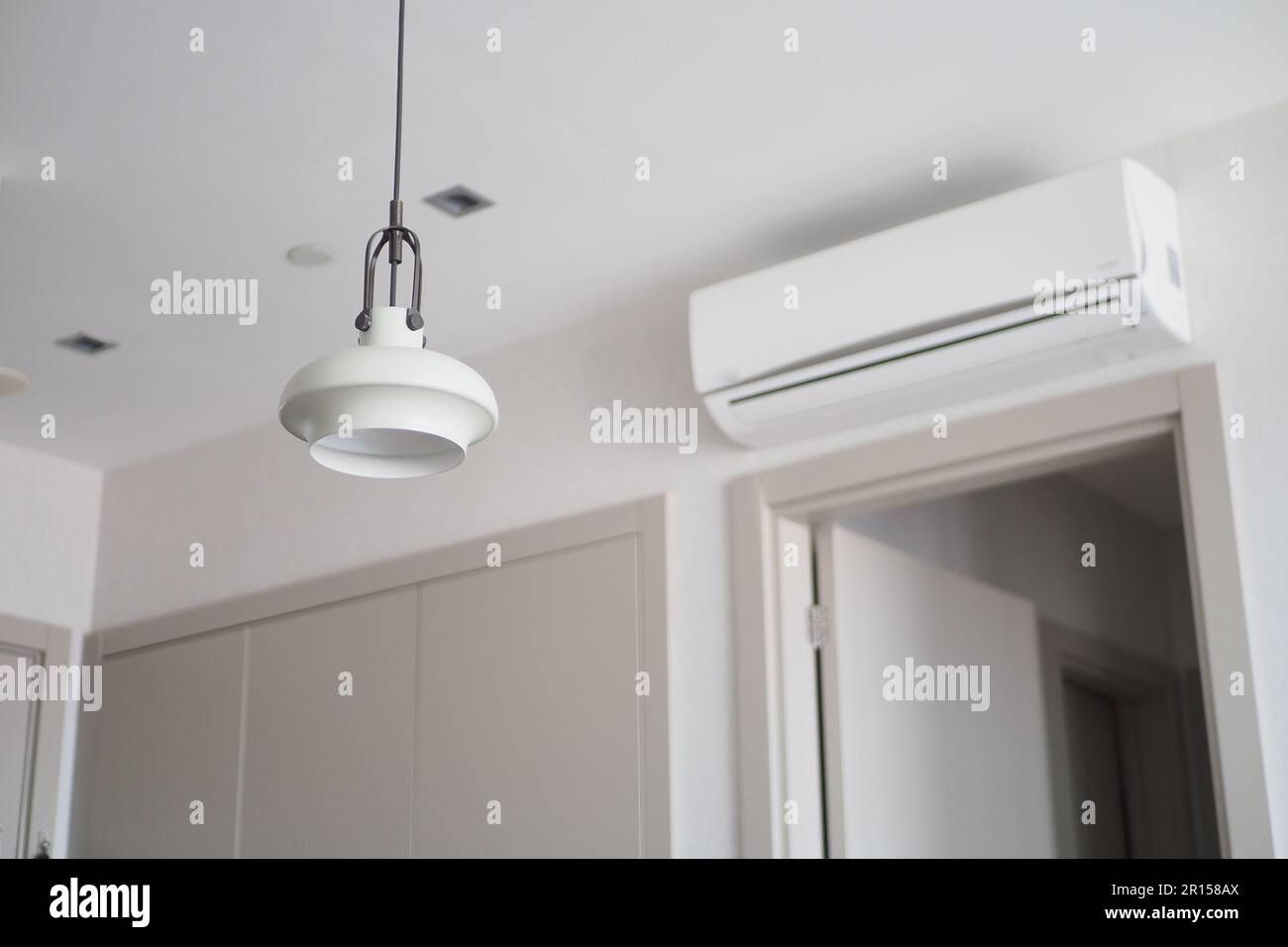 Air conditioner hanging on the wall Stock Photo - Alamy