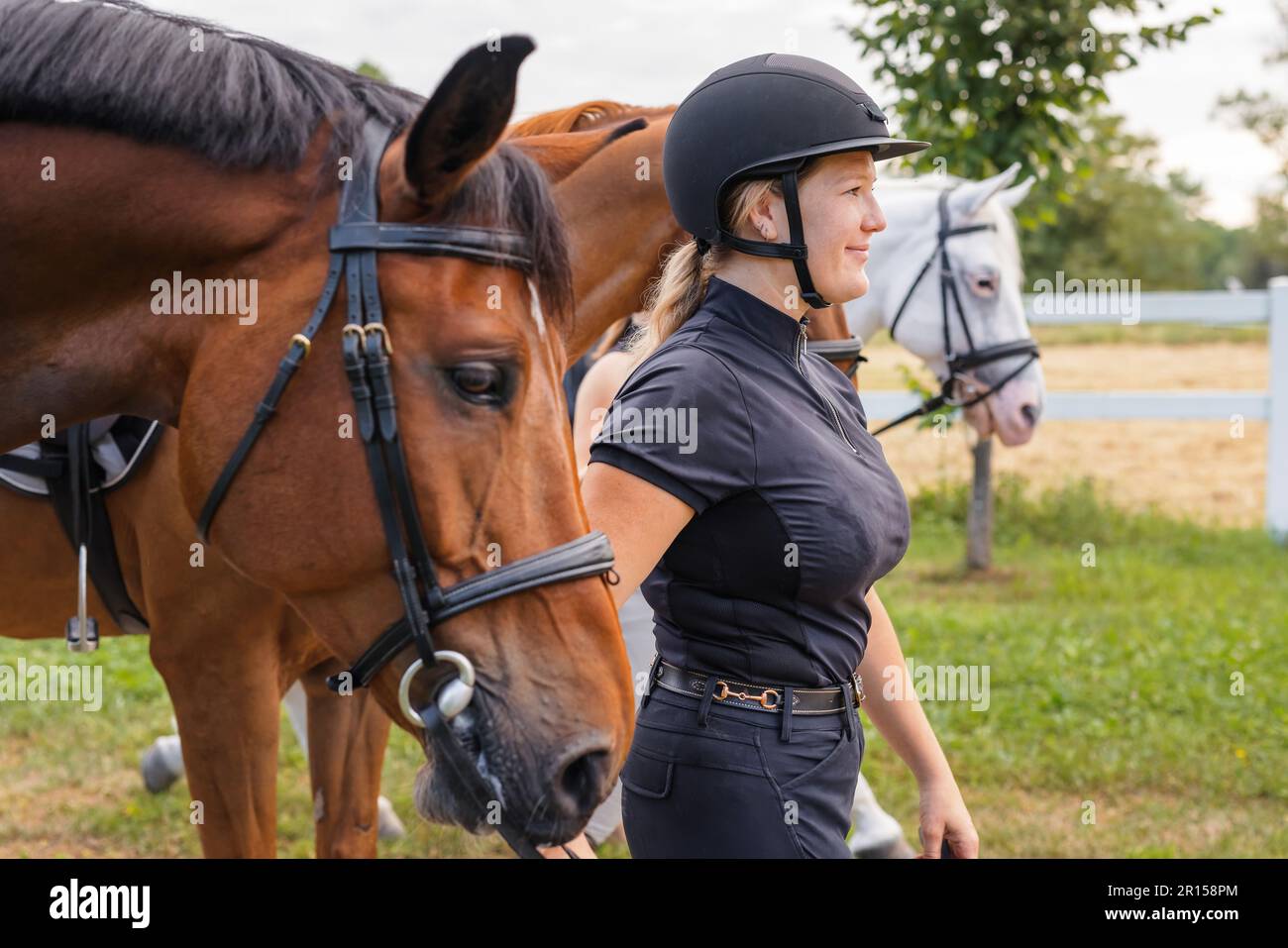 Portrait female jockey standing horse hi-res stock photography and ...