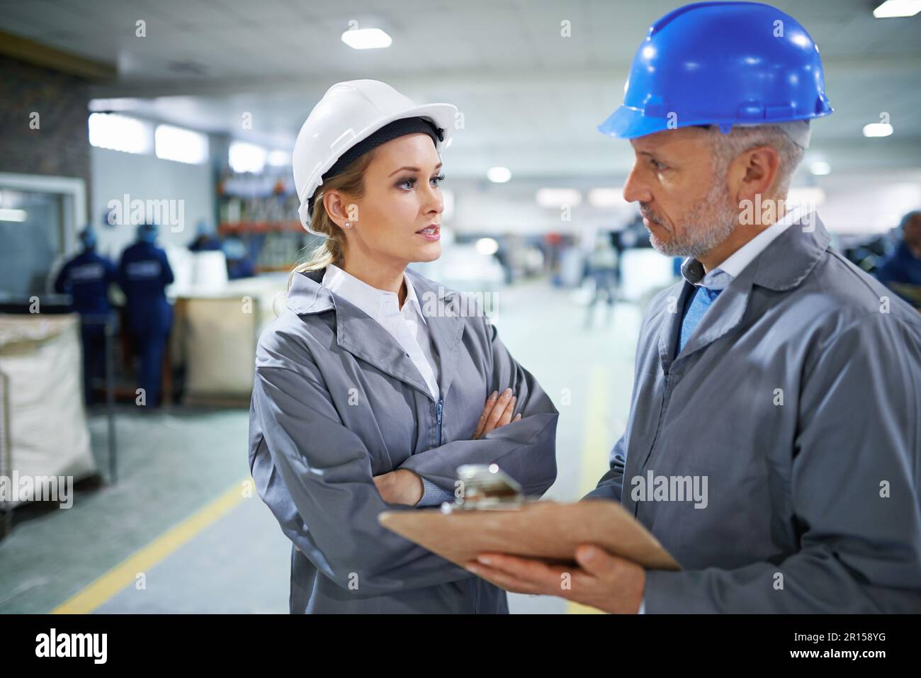Discussing logistics. a people working inside a printing, packaging and ...