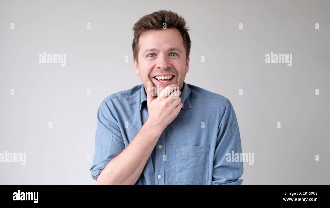 European funny young man is laughing loudly. Positive emotion Stock ...