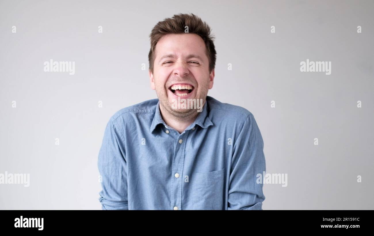 European funny young man is laughing loudly. Positive emotion Stock ...