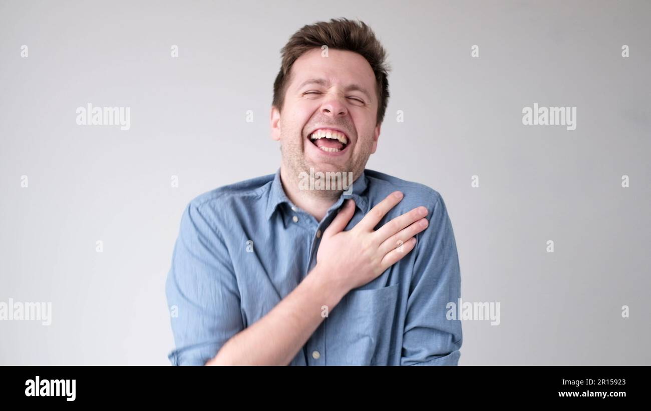 European funny young man is laughing loudly. Positive emotion Stock ...