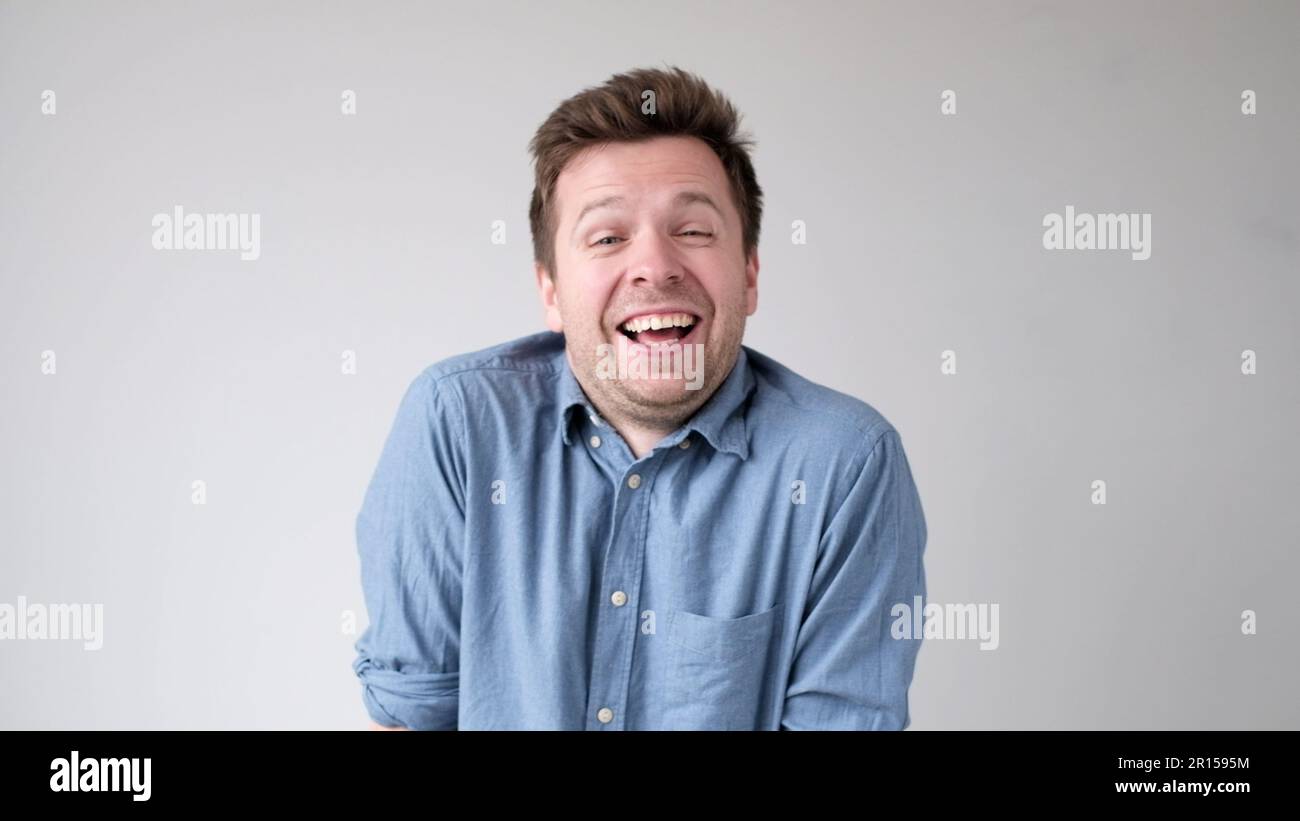 European funny young man is laughing loudly. Positive emotion Stock ...