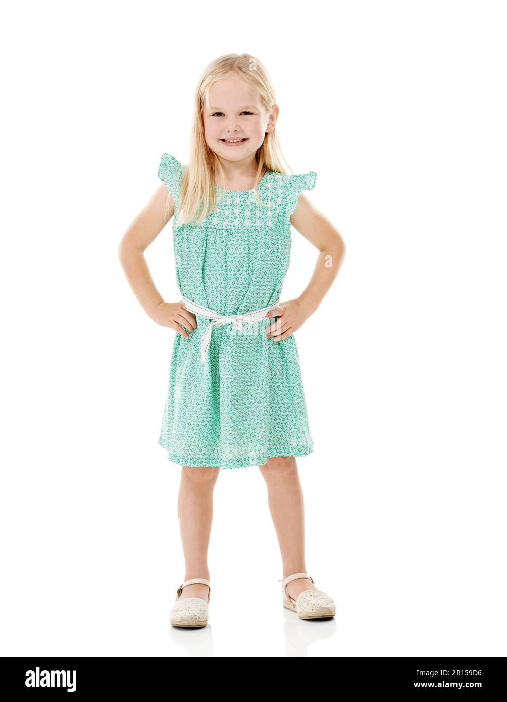 This is my best summer dress. Studio shot of a cute little girl in a ...