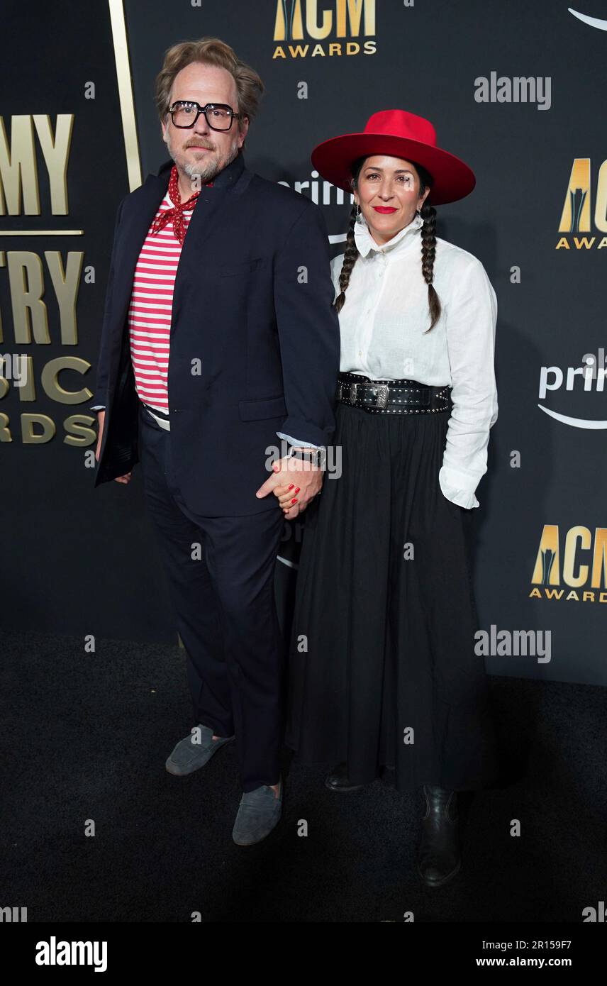 Luke Dick, left, and Alison Love arrive at the 58th annual Academy of ...