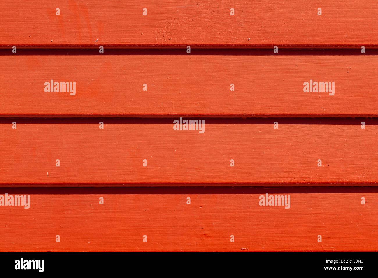 red wooden wall with structure of wood as harmonic bright background ...