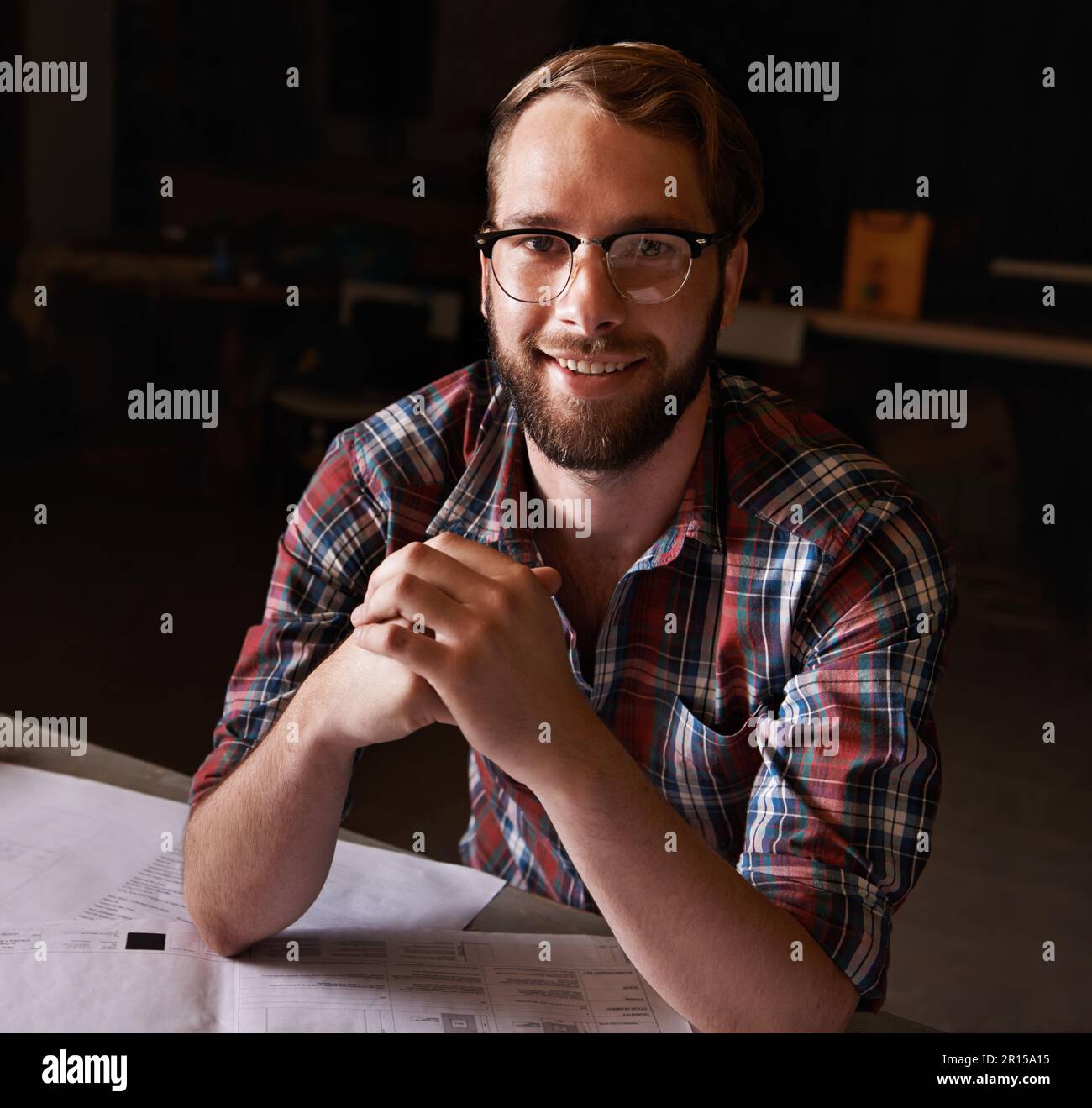 Turning his vision into reality. An architect drawing up plans Stock ...