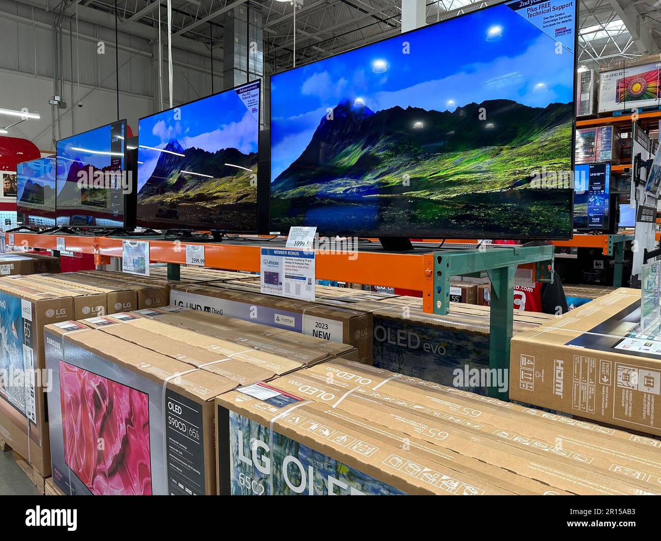 Big-screen televisions stand on display in a Costco warehouse Wdnesday ...