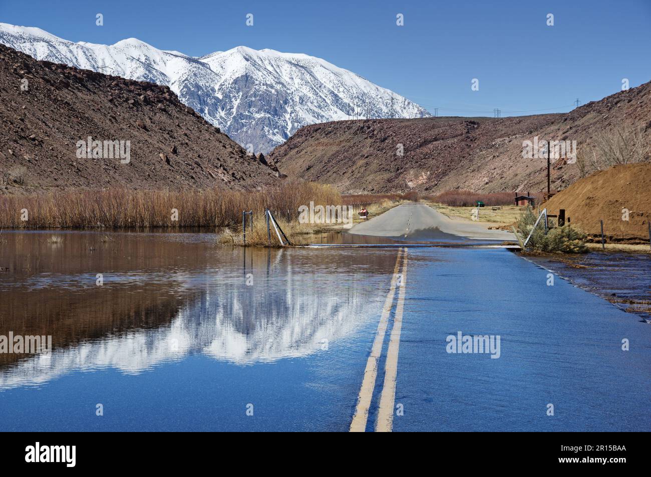 shallow flooded road in Pleasant Valley in the Owens Valley of Eastern ...