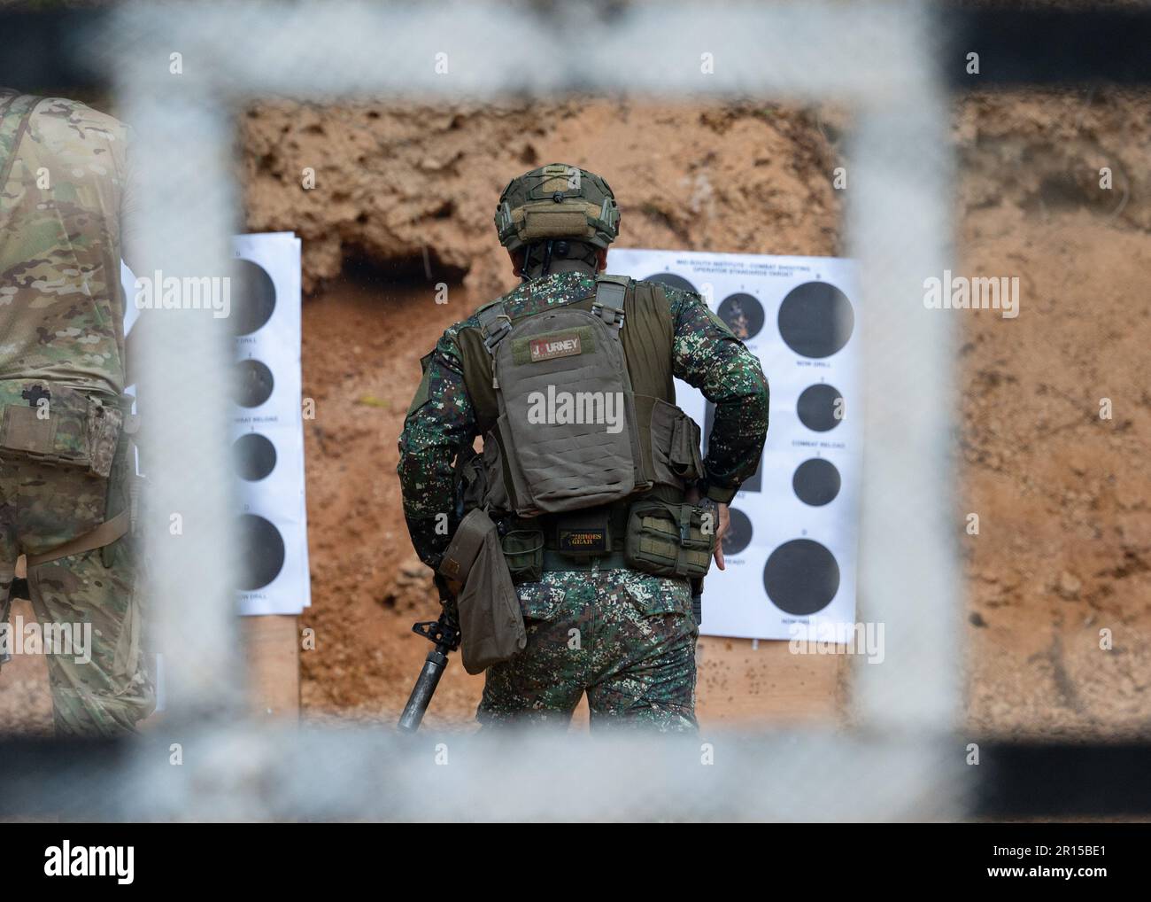 230421-N-OX430-1258 A Philippine Marine draws his pistol while ...