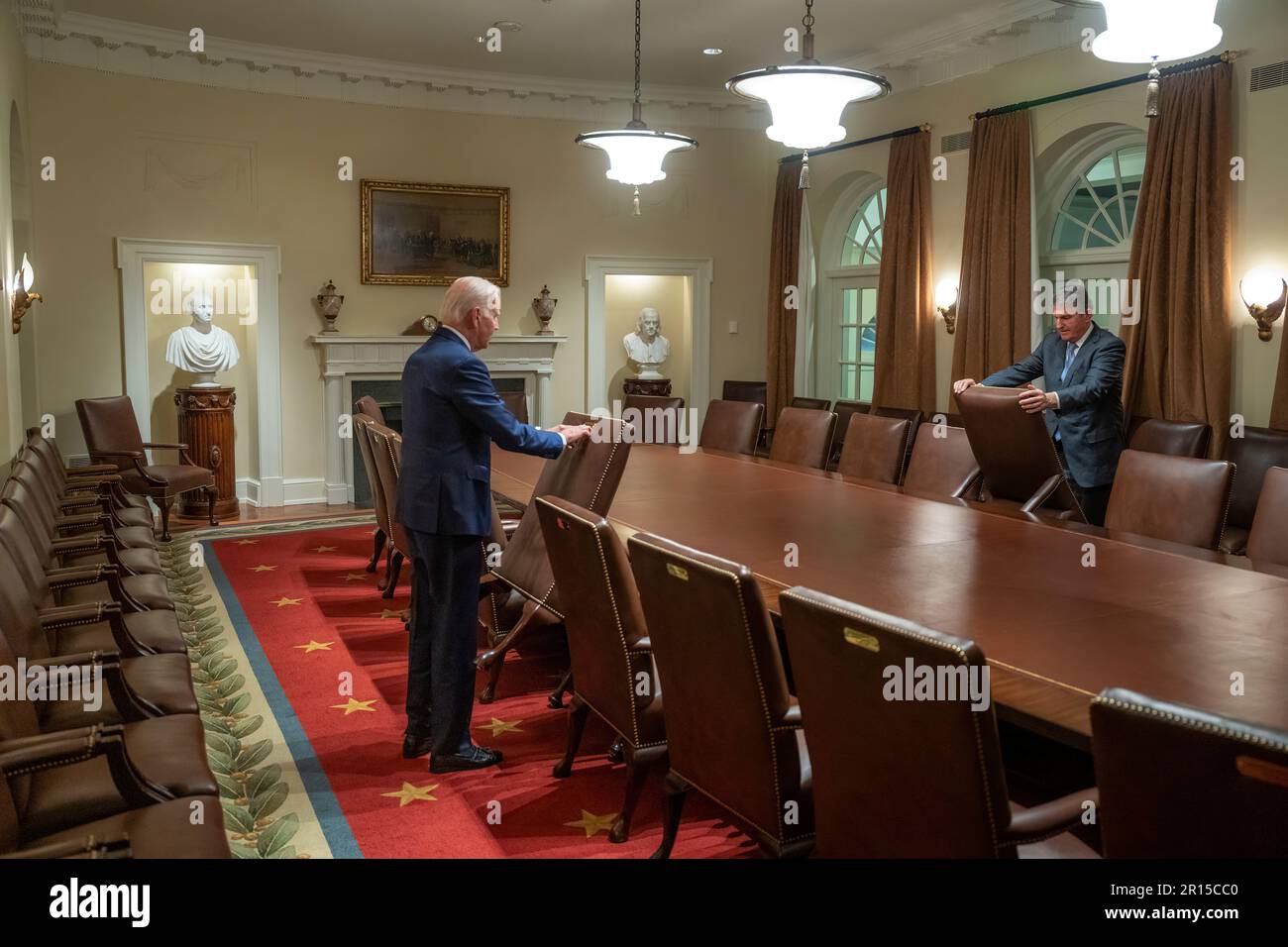 President Joe Biden and U.S. Senator Joe Manchin, D-W.Va., look at the ...