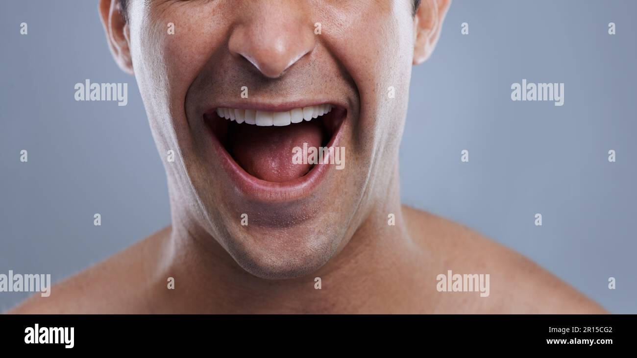 Barrel of laughs. Closeup cropped image of a laughing mans mouth Stock ...