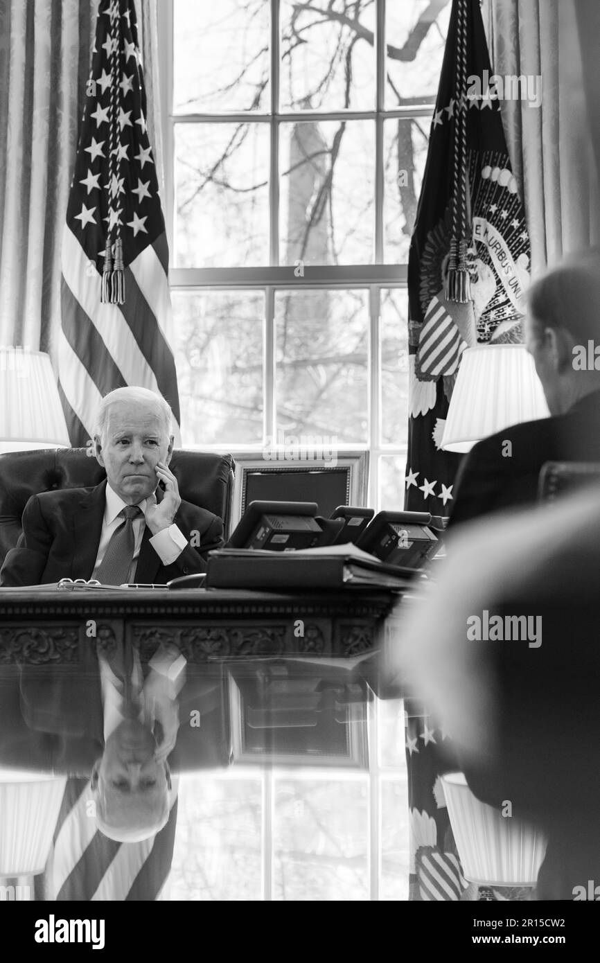 President Joe Biden talks on the phone with French President Emmanuel ...