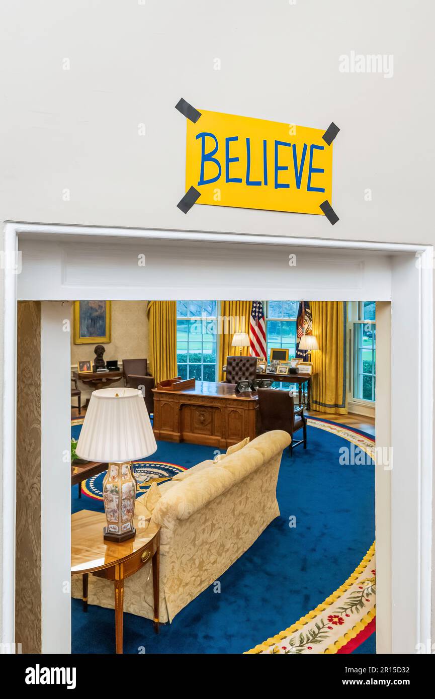 A “Believe” sign is posted above the Oval Office door in reference to ...