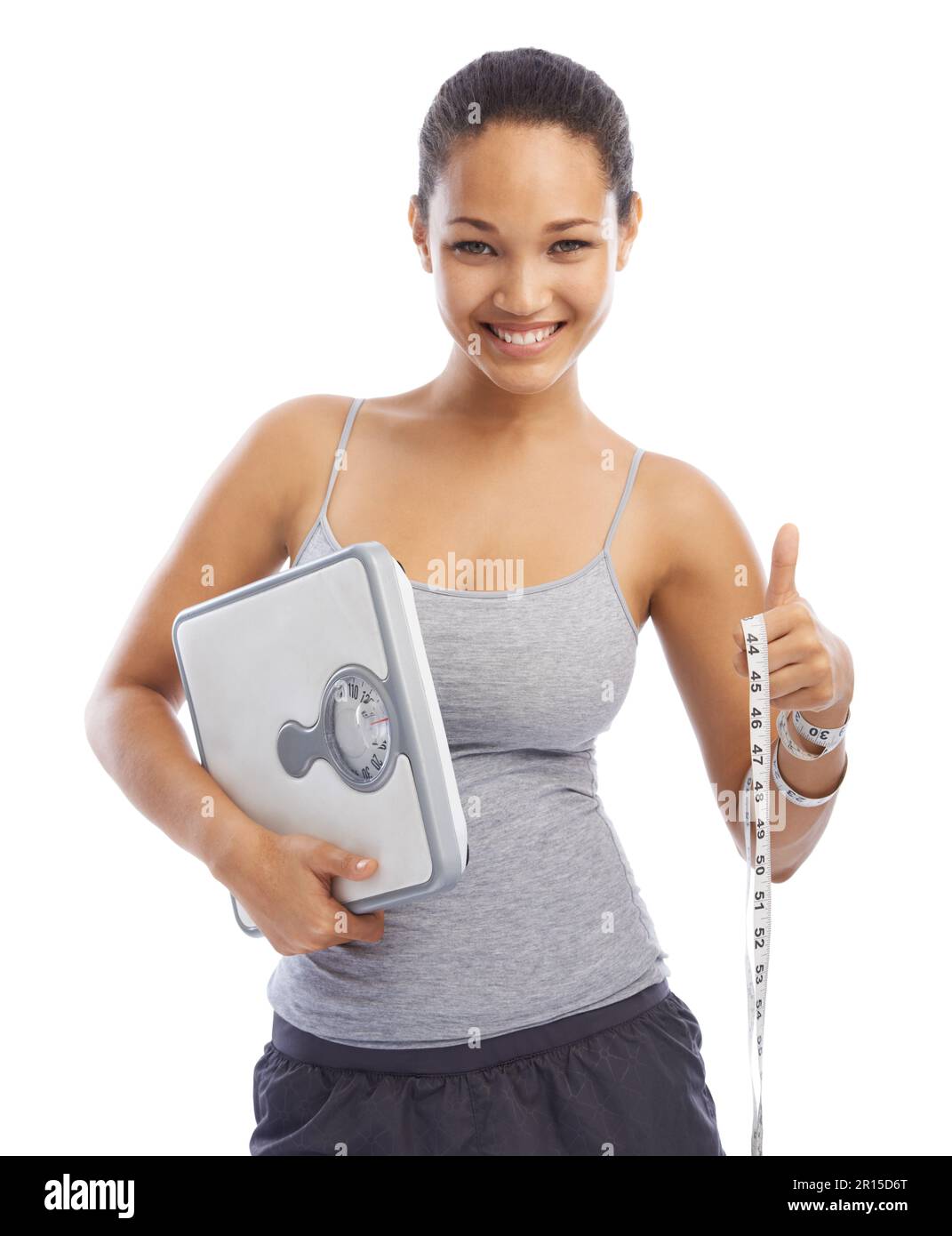 Losing weight the healthy way. A gorgeous young woman in sportswear ...