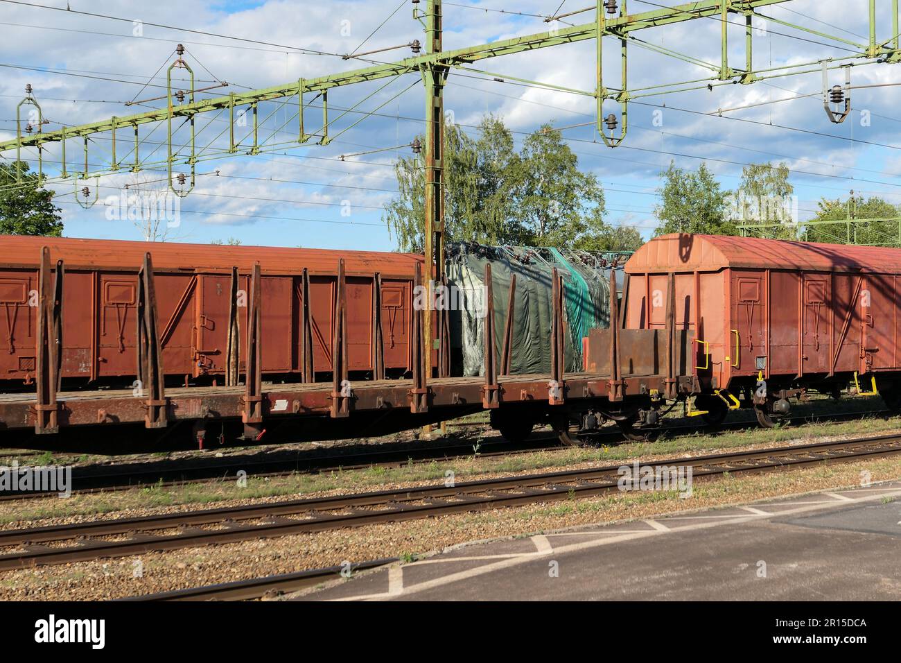 old freight cars on railway tracks during the summer Stock Photo - Alamy