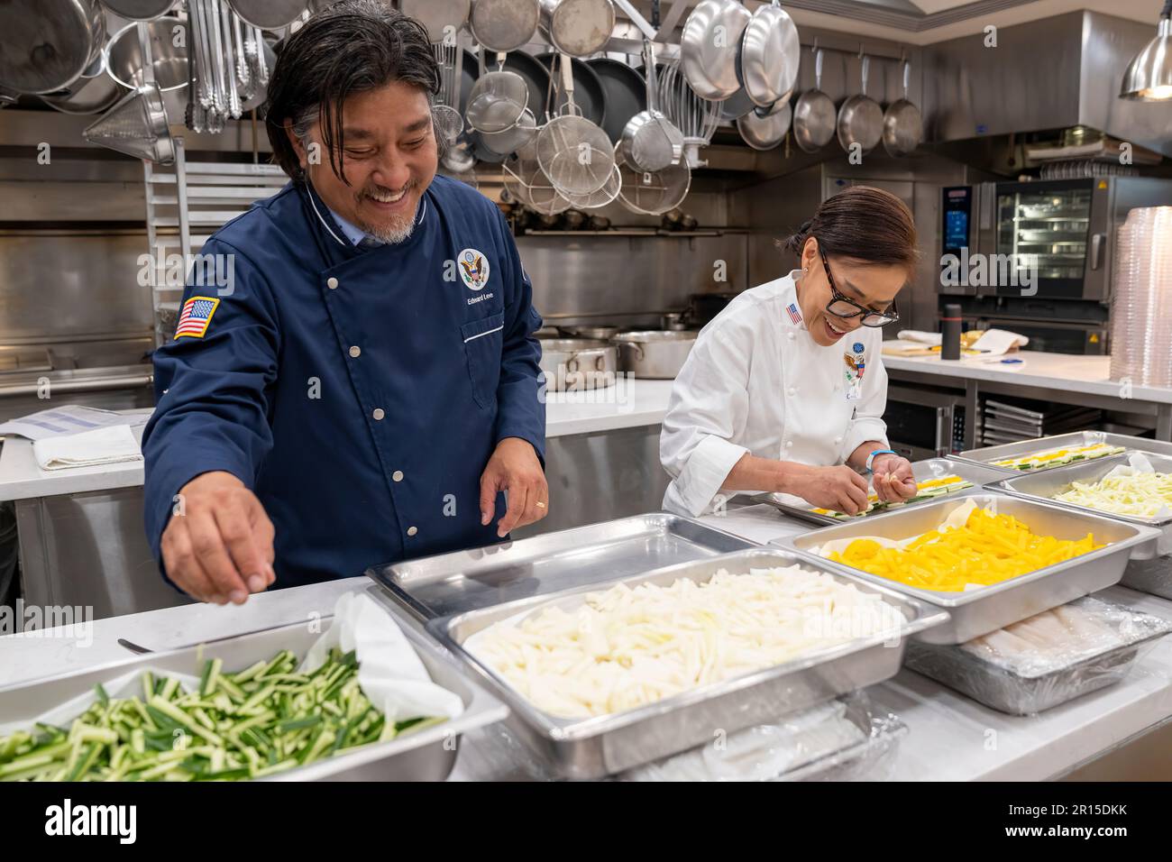 Visiting Chef Edward Lee prepares food in the White House Kitchen with ...