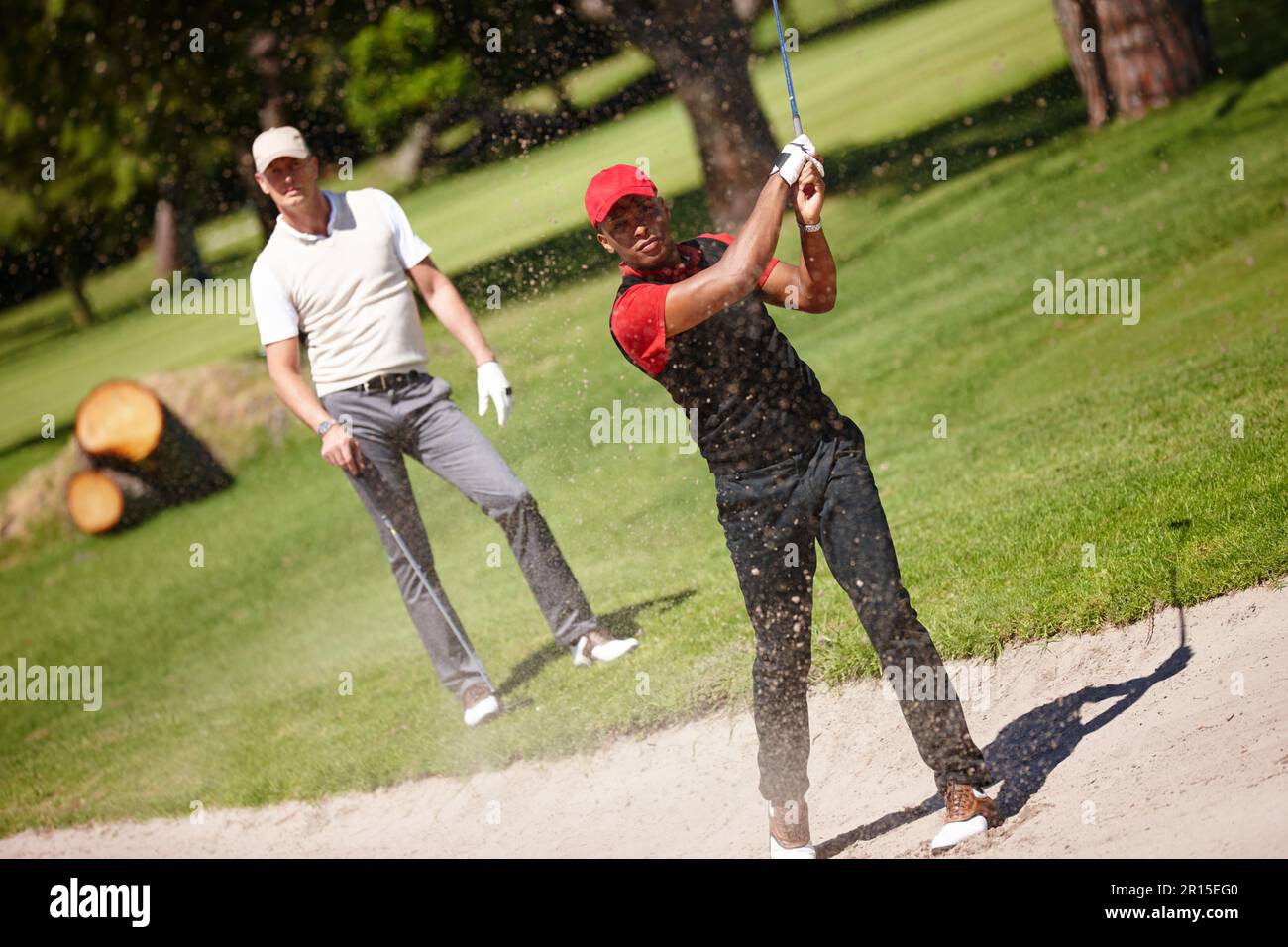 Sure of his shot. two handsome men playing a game of golf Stock Photo ...