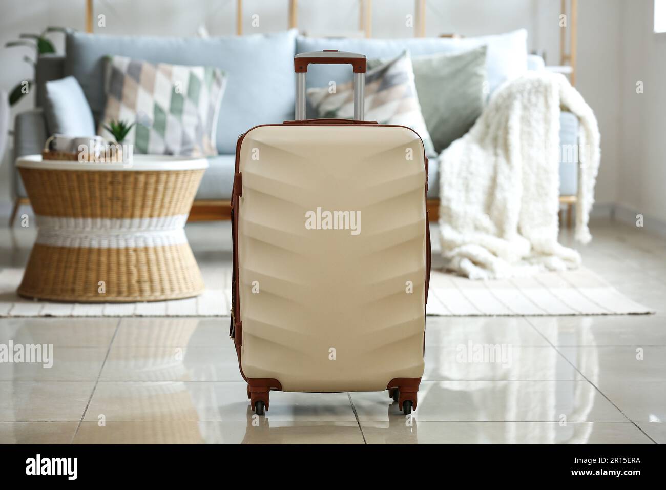 Big suitcase in living room Stock Photo - Alamy
