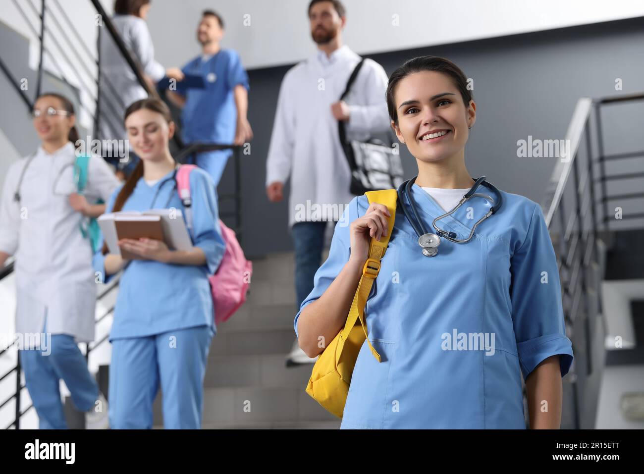 Portrait of medical student with stethoscope on staircase in college ...