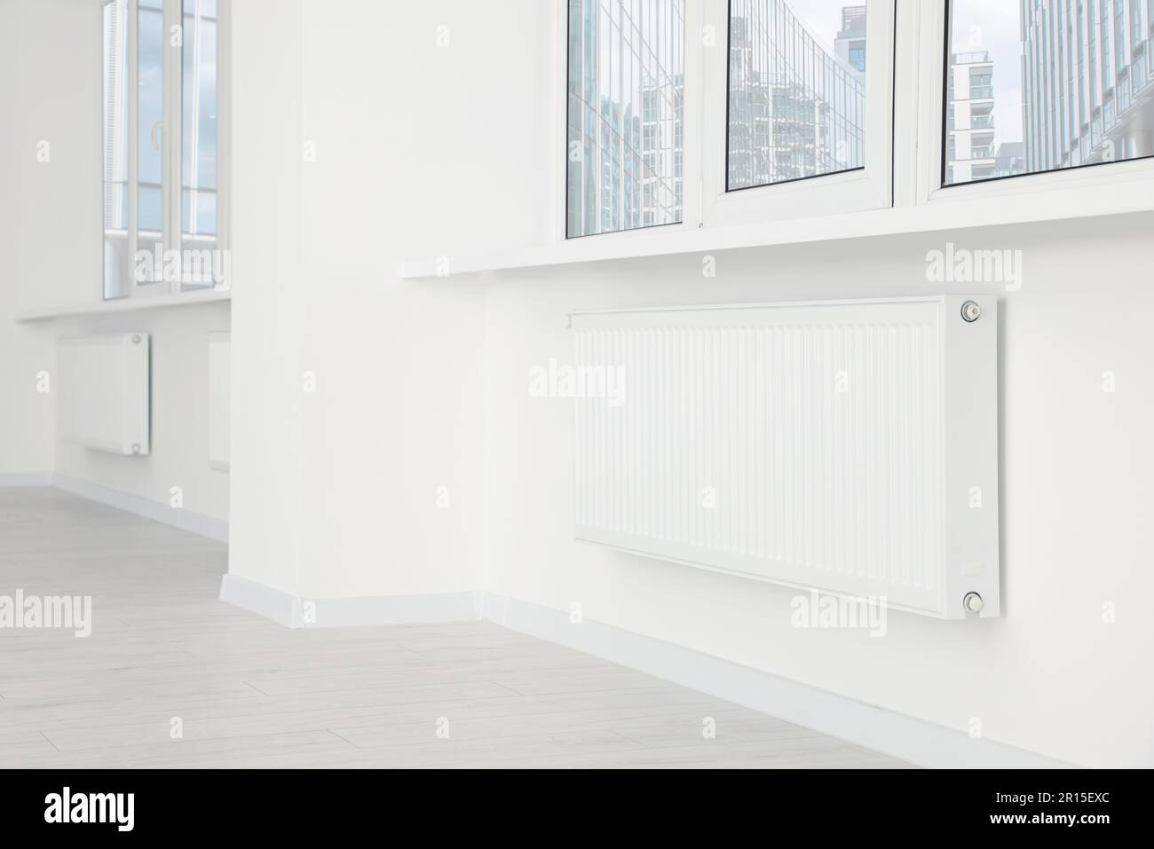 Modern office room with radiators and windows. Interior design Stock ...