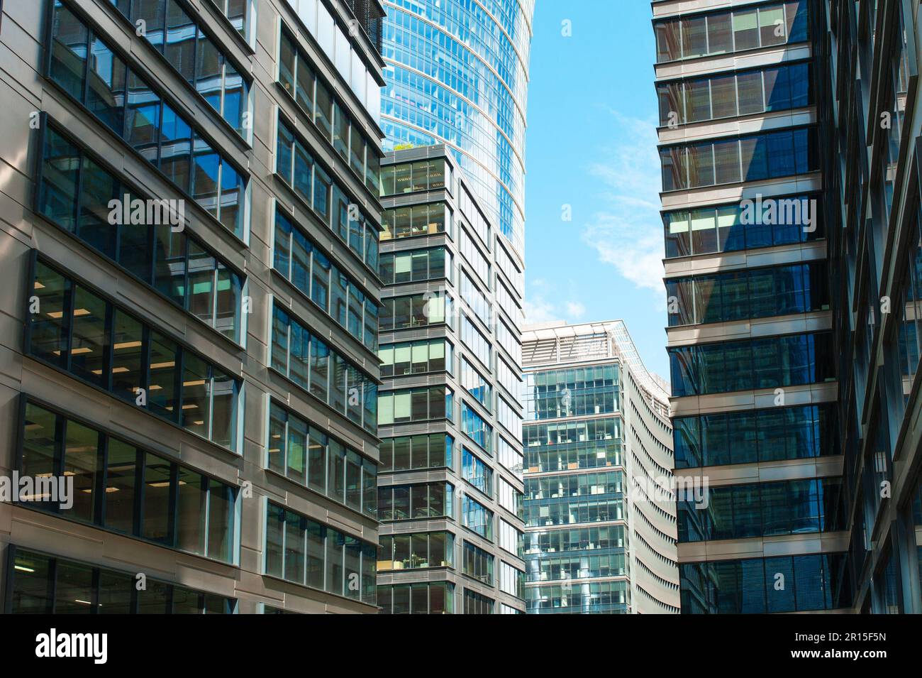 Stylish buildings with many windows under cloudy sky Stock Photo - Alamy