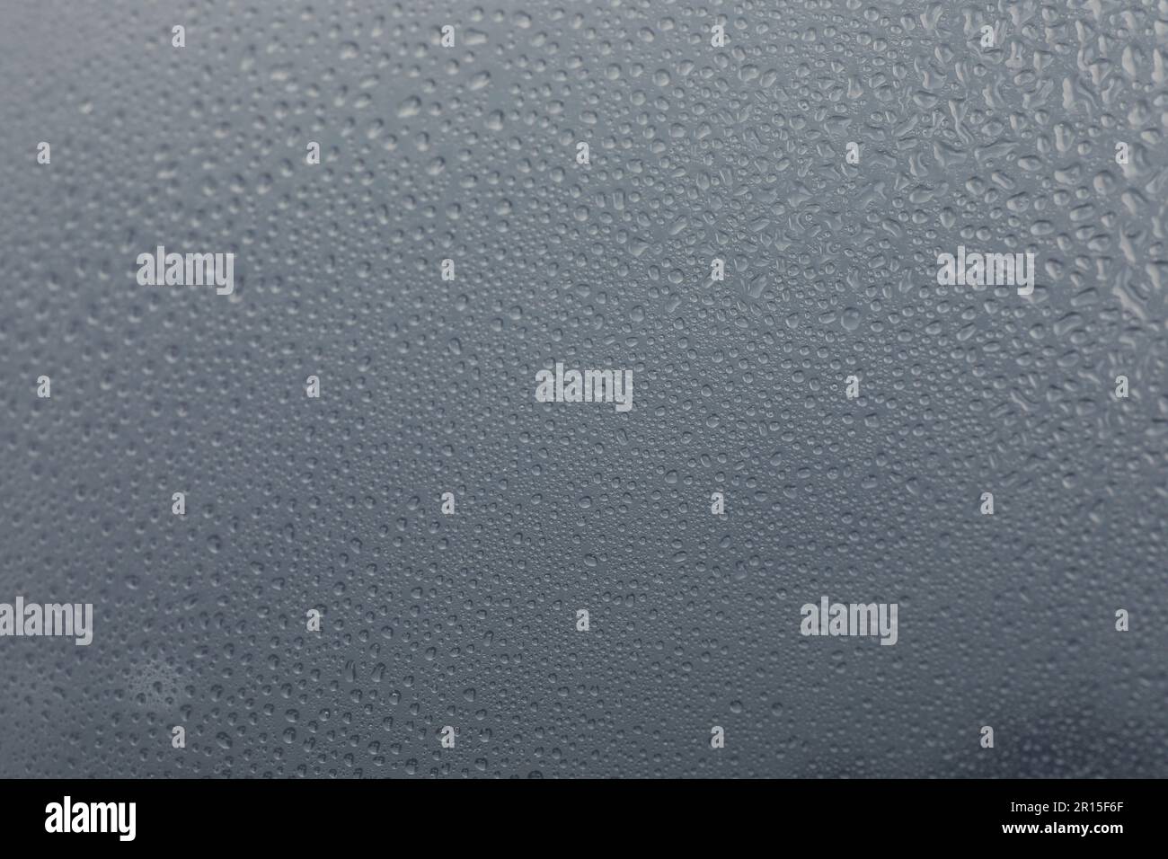 Window glass with water drops on light grey background, closeup Stock ...