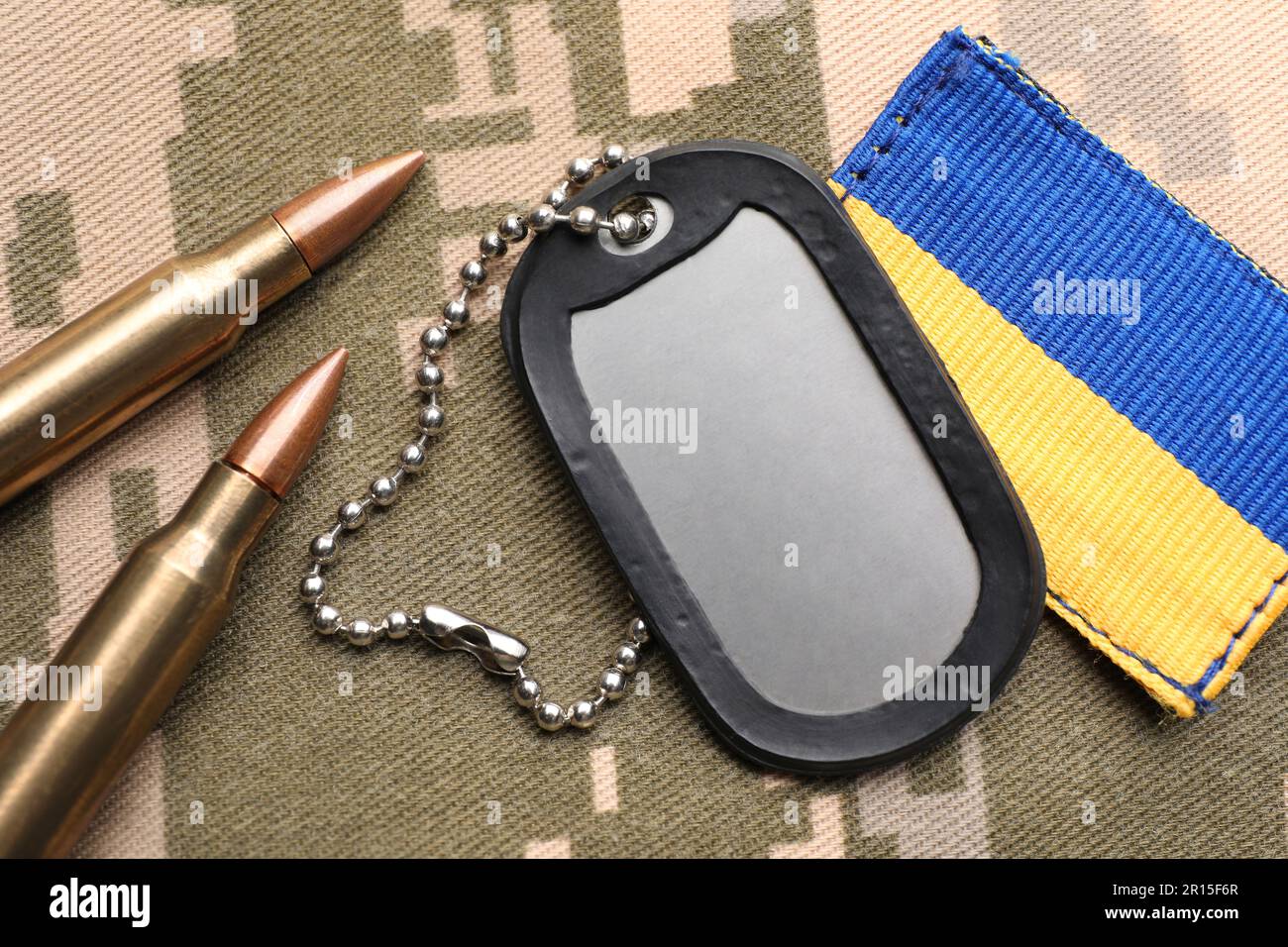 Military ID tag, bullets and patch on pixel Ukrainian camouflage, flat ...