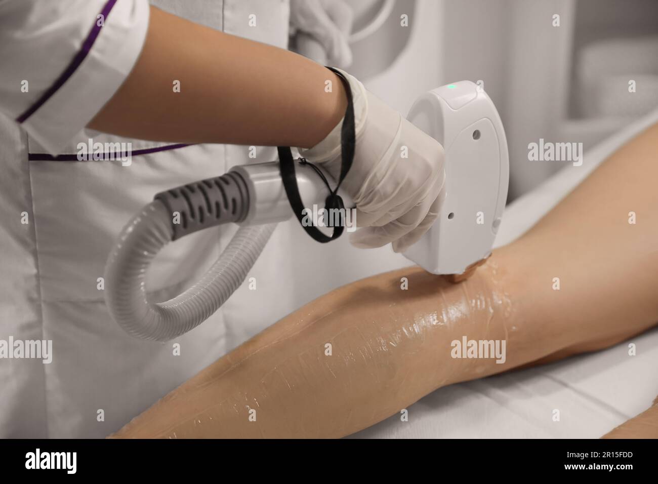 Woman undergoing laser epilation procedure in beauty salon, closeup ...