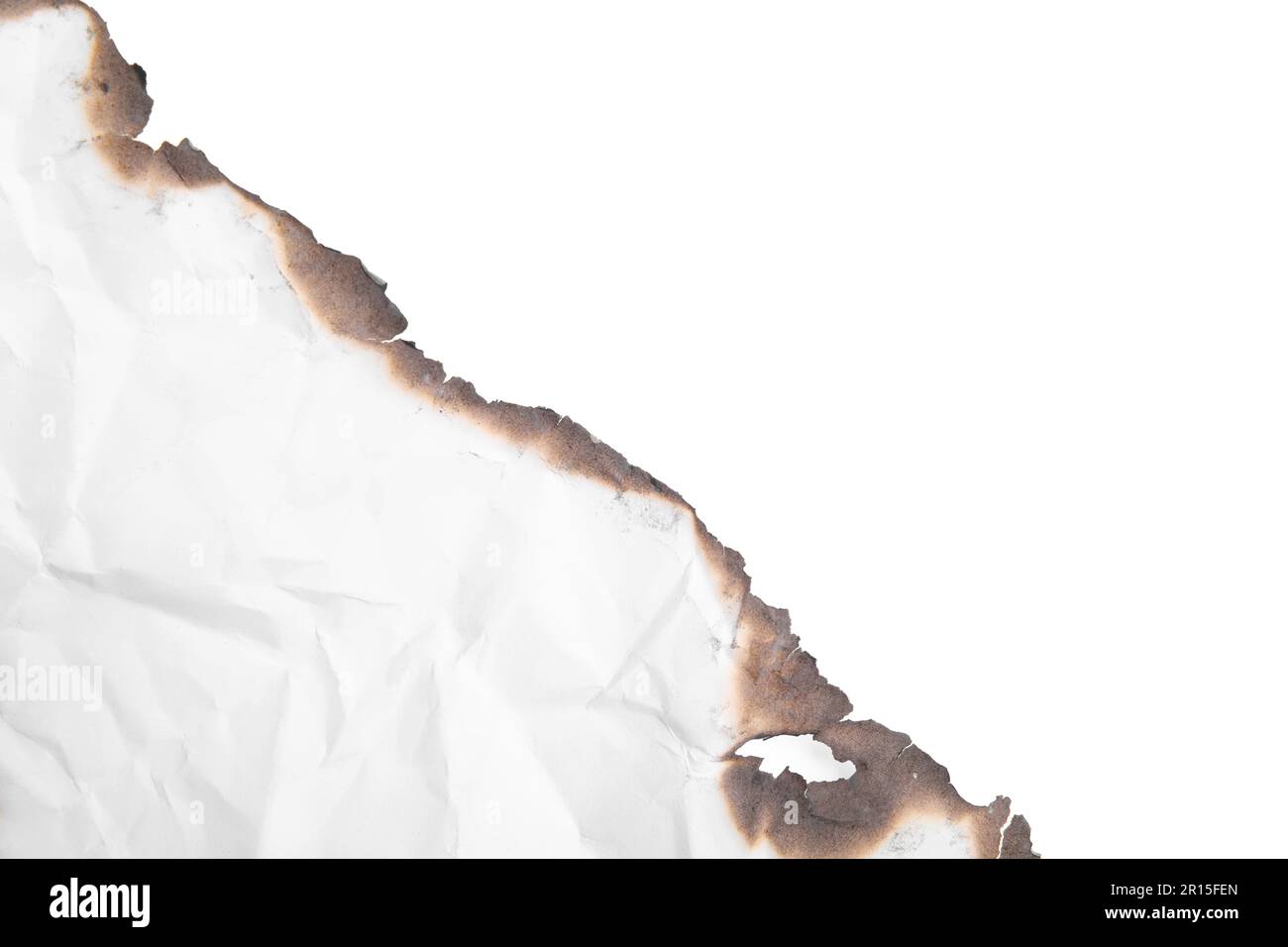 Piece of crumpled paper with dark burnt borders on white background ...