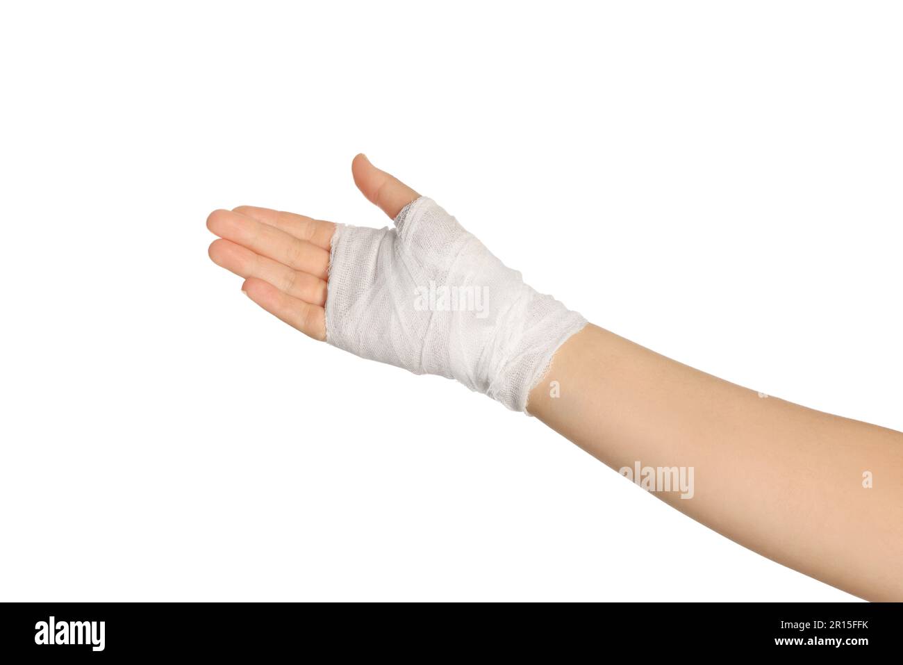 Woman with hand wrapped in medical bandage on white background, closeup ...