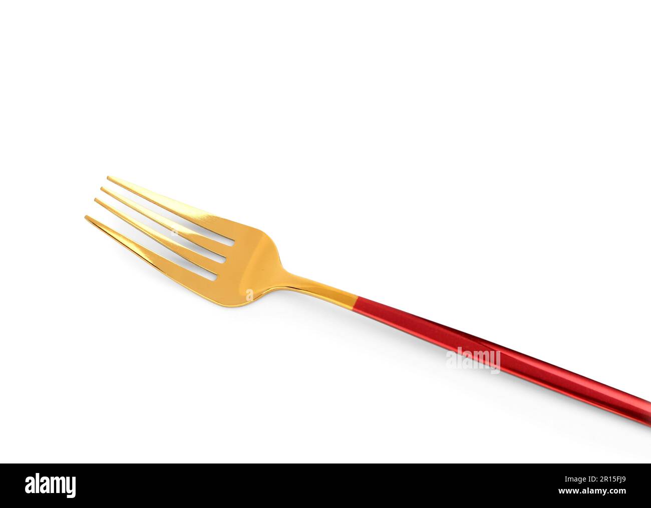 Golden fork with red handle on white background Stock Photo - Alamy