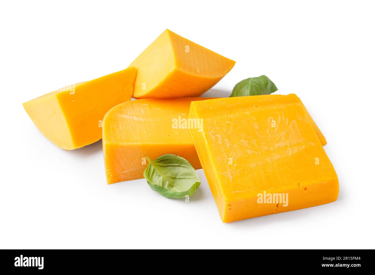 Pieces of tasty cheddar cheese on white background Stock Photo - Alamy